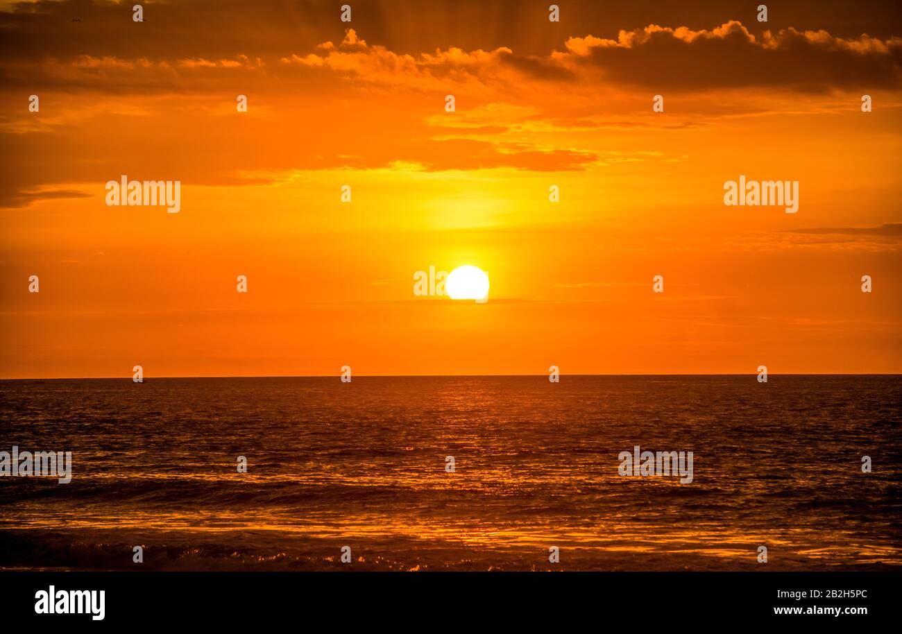 Romantic Sunset with strong orange color Stock Photo - Alamy