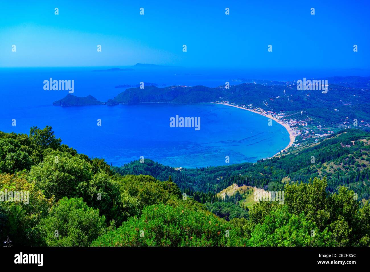 Agios Georgios beach at paradise bay in beautiful mountain scenery ...