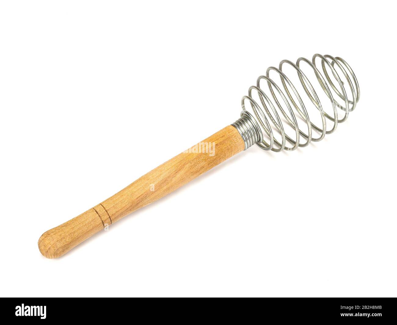 Houseware: steel whisk with wooden handle isolated on white background ...
