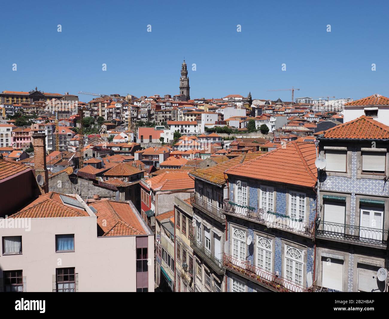 PORTO, PORTUGAL on SEPTEMBER 2019: Buildings with red roofs and tower ...