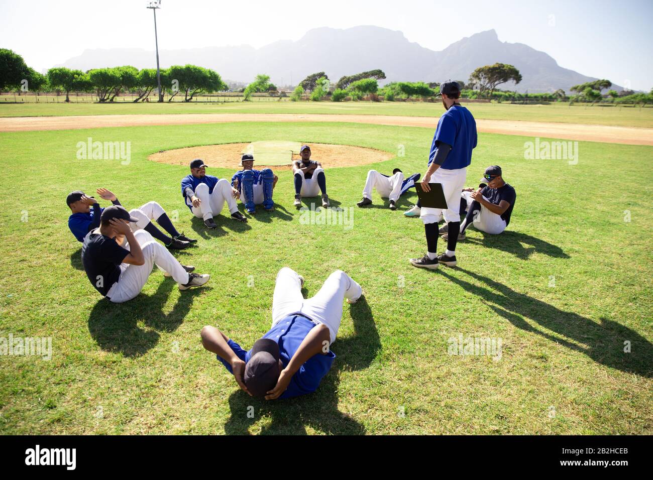 Trainer stretching player hi-res stock photography and images - Alamy