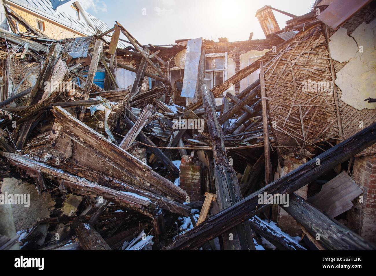Collapsed ruined old wooden abandoned house in poor district Stock ...