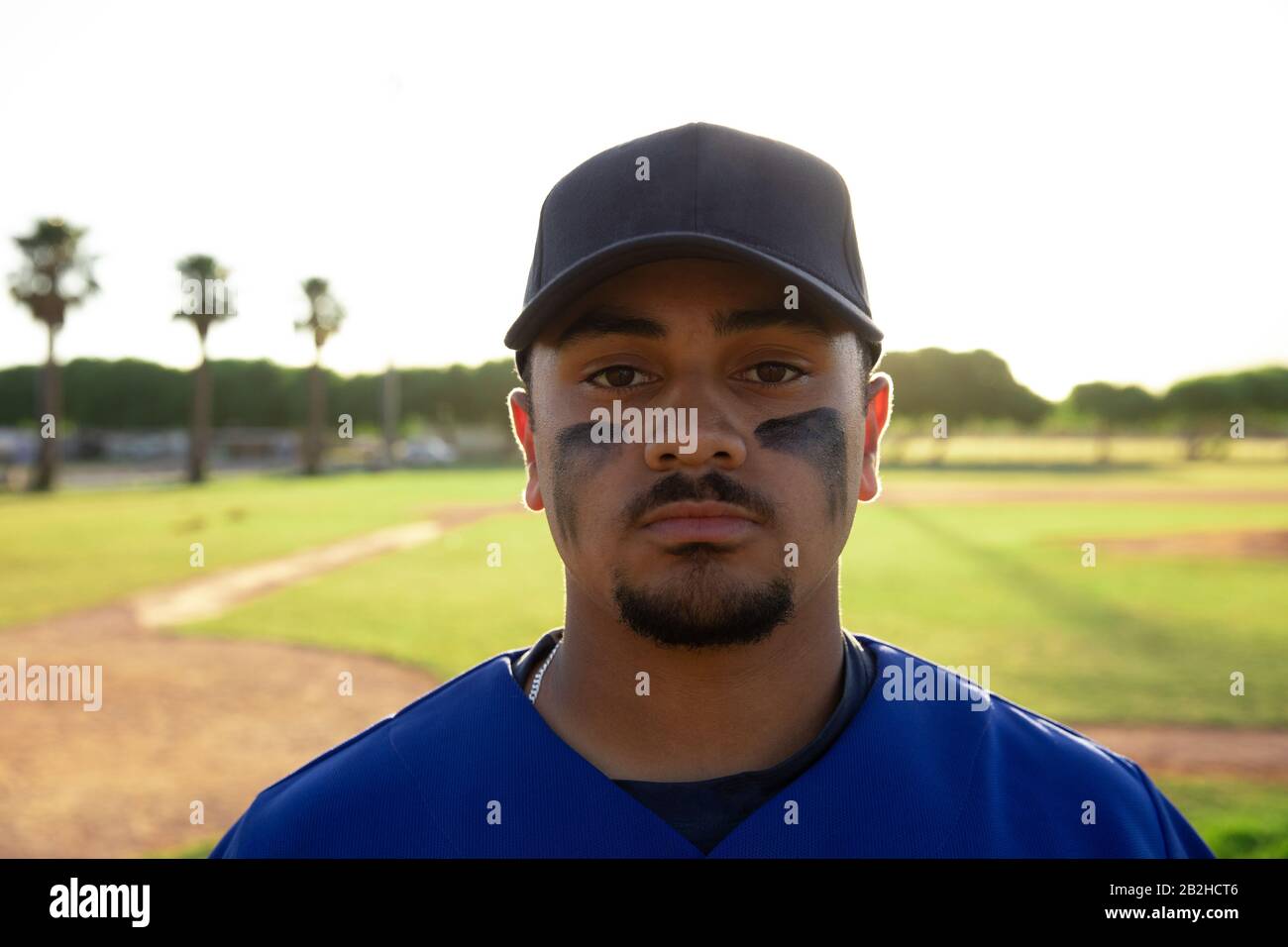 Baseball player looking at camera Stock Photo - Alamy