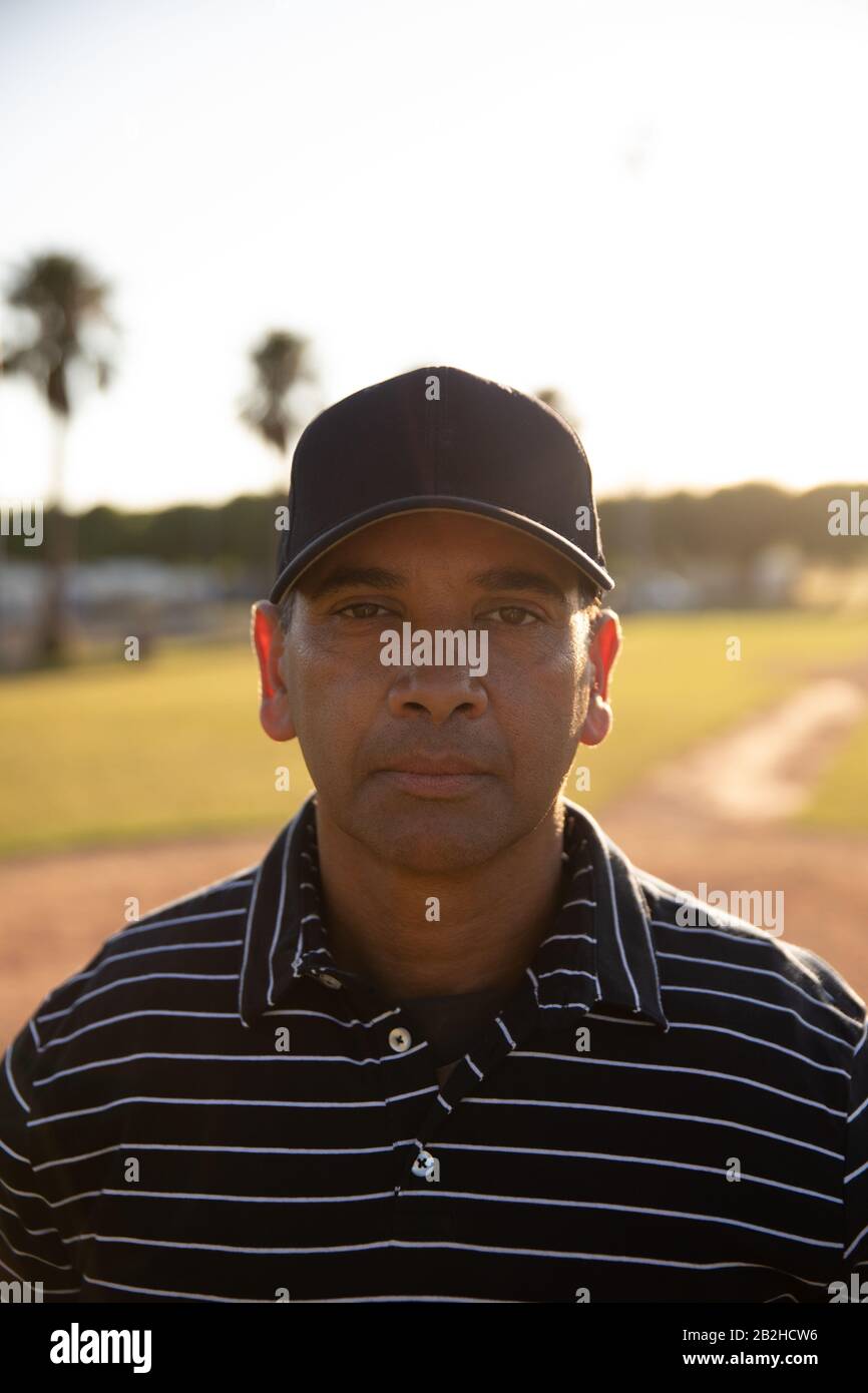 Baseball coach looking at camera Stock Photo - Alamy