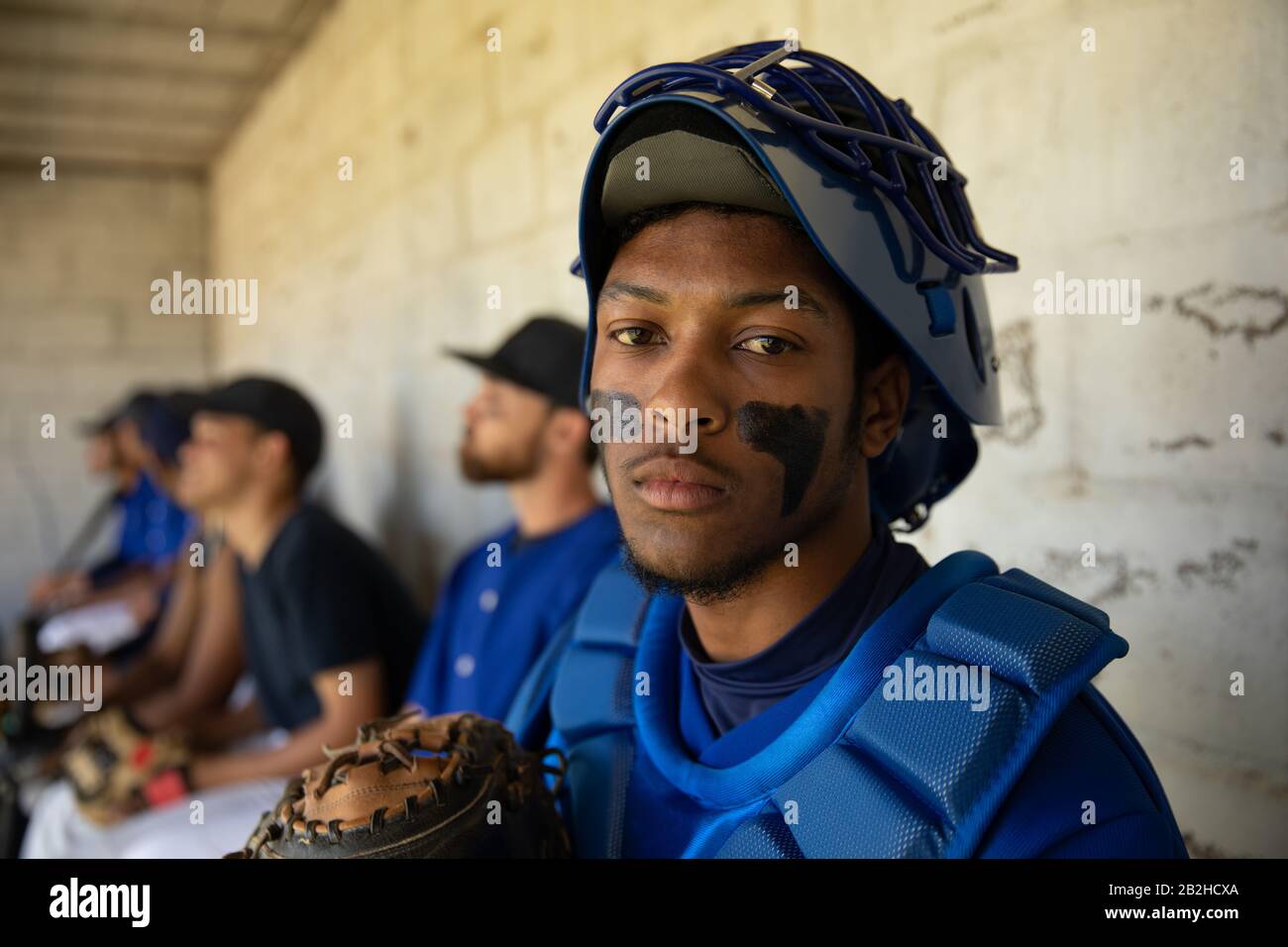 Baseball player looking at camera Stock Photo - Alamy