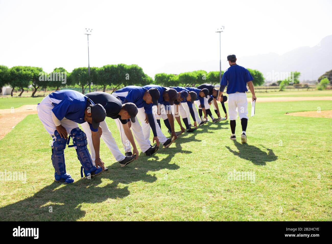 Trainer stretching player hi-res stock photography and images - Alamy