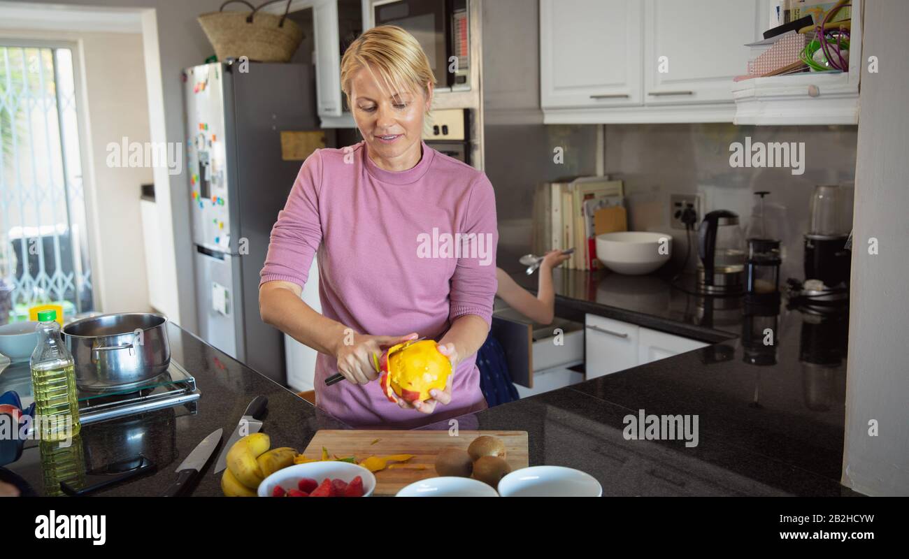 Beautiful woman cooking in hi-res stock photography and images - Alamy