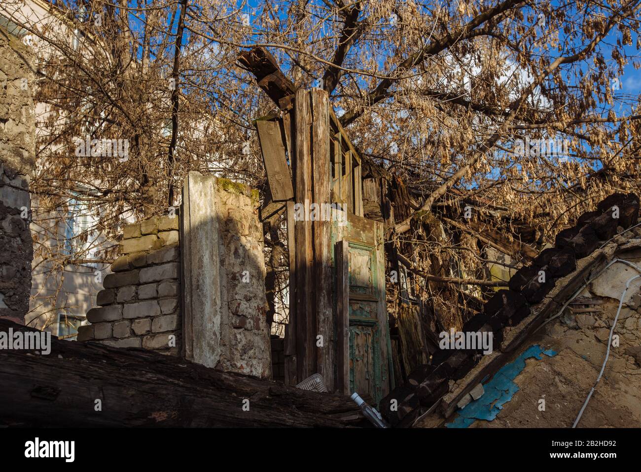 Collapsed ruined old wooden abandoned house in poor district Stock ...