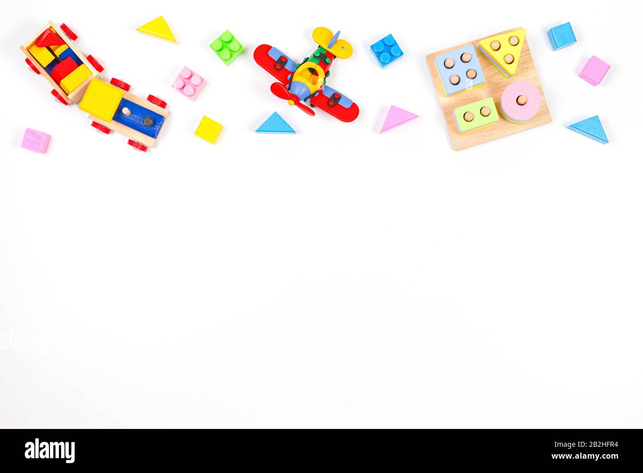 Baby kids toys background. Wooden educational geometric stacking blocks ...