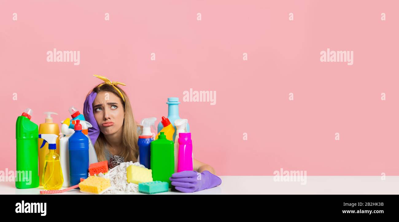 Cleaning again. Girl sadly looks up, props up head a hand Stock Photo ...