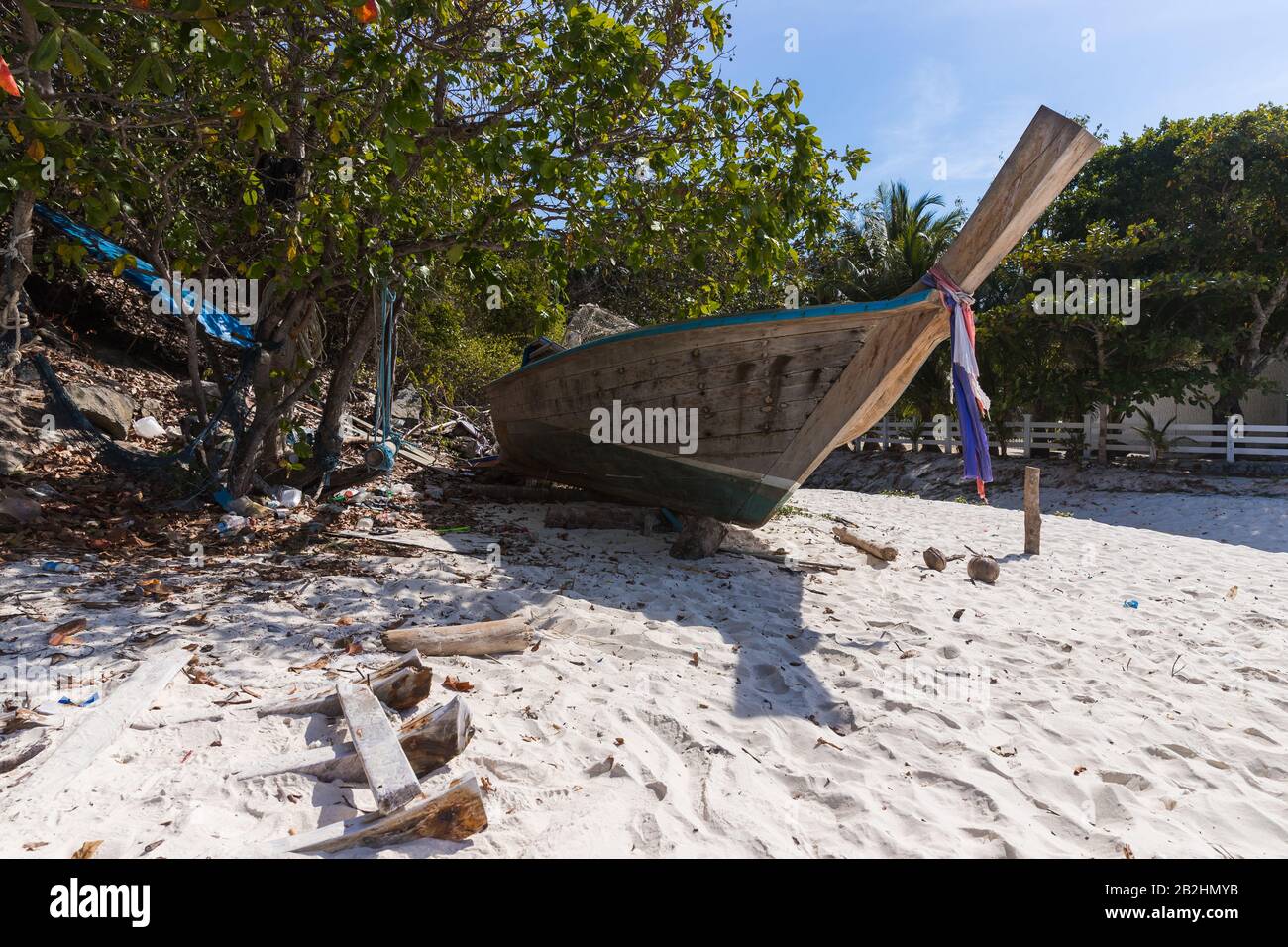 A broken boat stands on the sand. Boat by the sea. Fishing boat washed ...