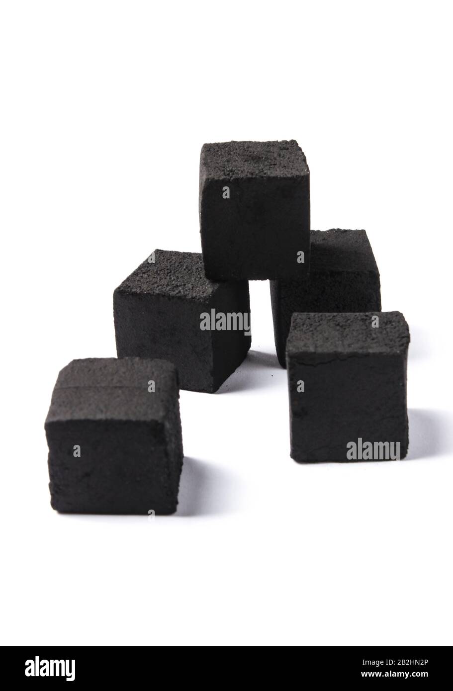 Cubes of coal for hookah isolated on white Stock Photo - Alamy
