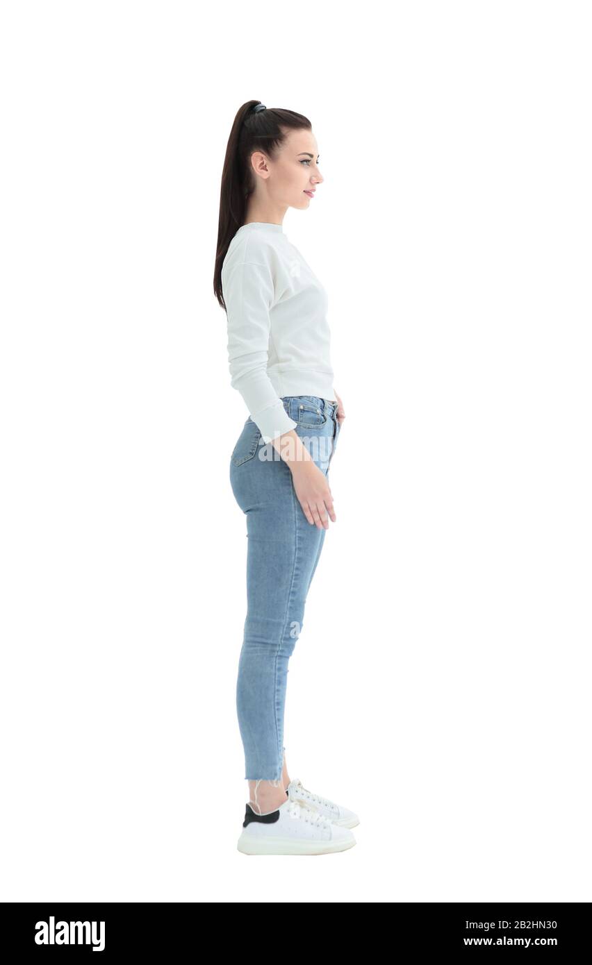 side view. stylish young woman in jeans and white blouse Stock Photo ...