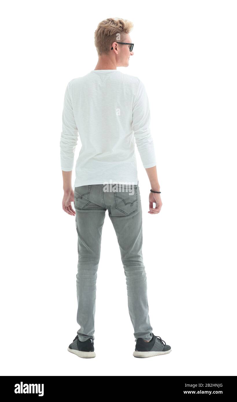 rear view. young man standing in front of white wall Stock Photo - Alamy