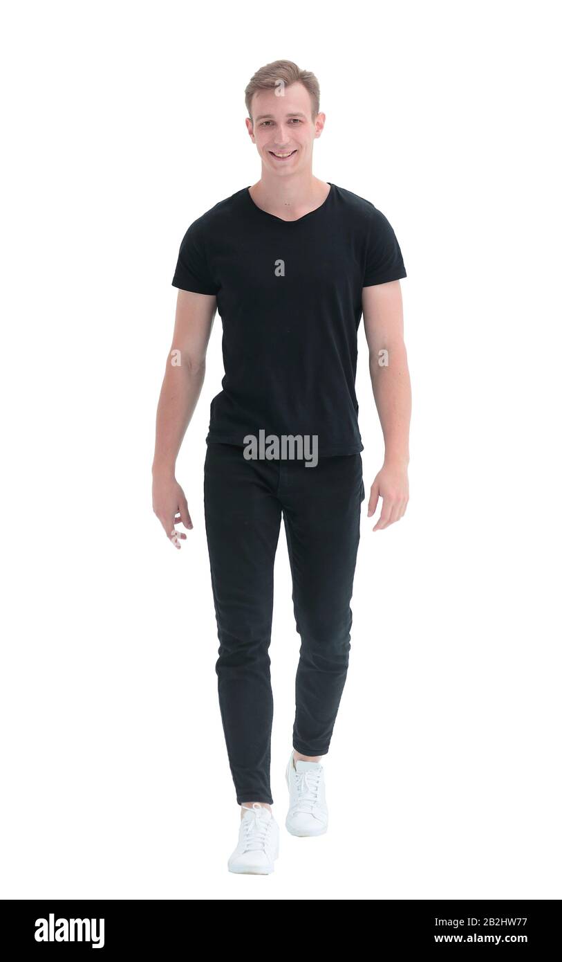 in full growth. confident young man taking a step forward Stock Photo ...