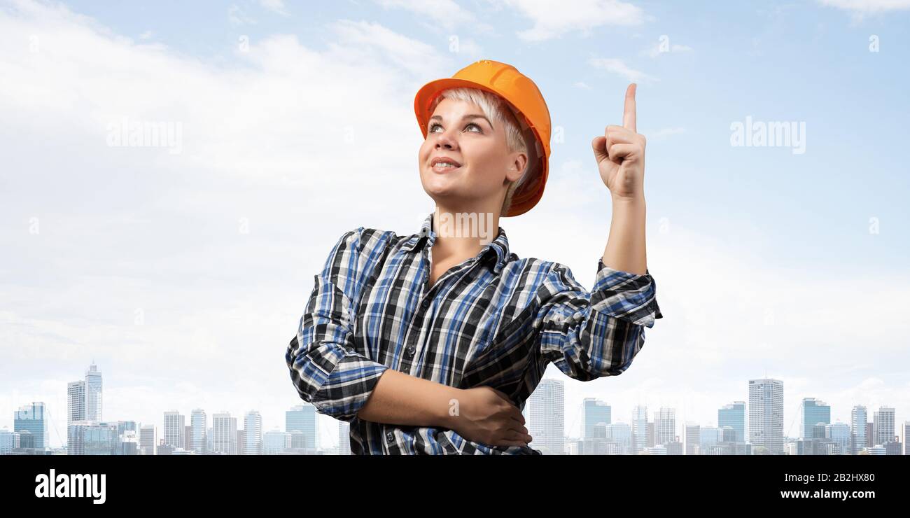 Beautiful female builder in hardhat Stock Photo - Alamy