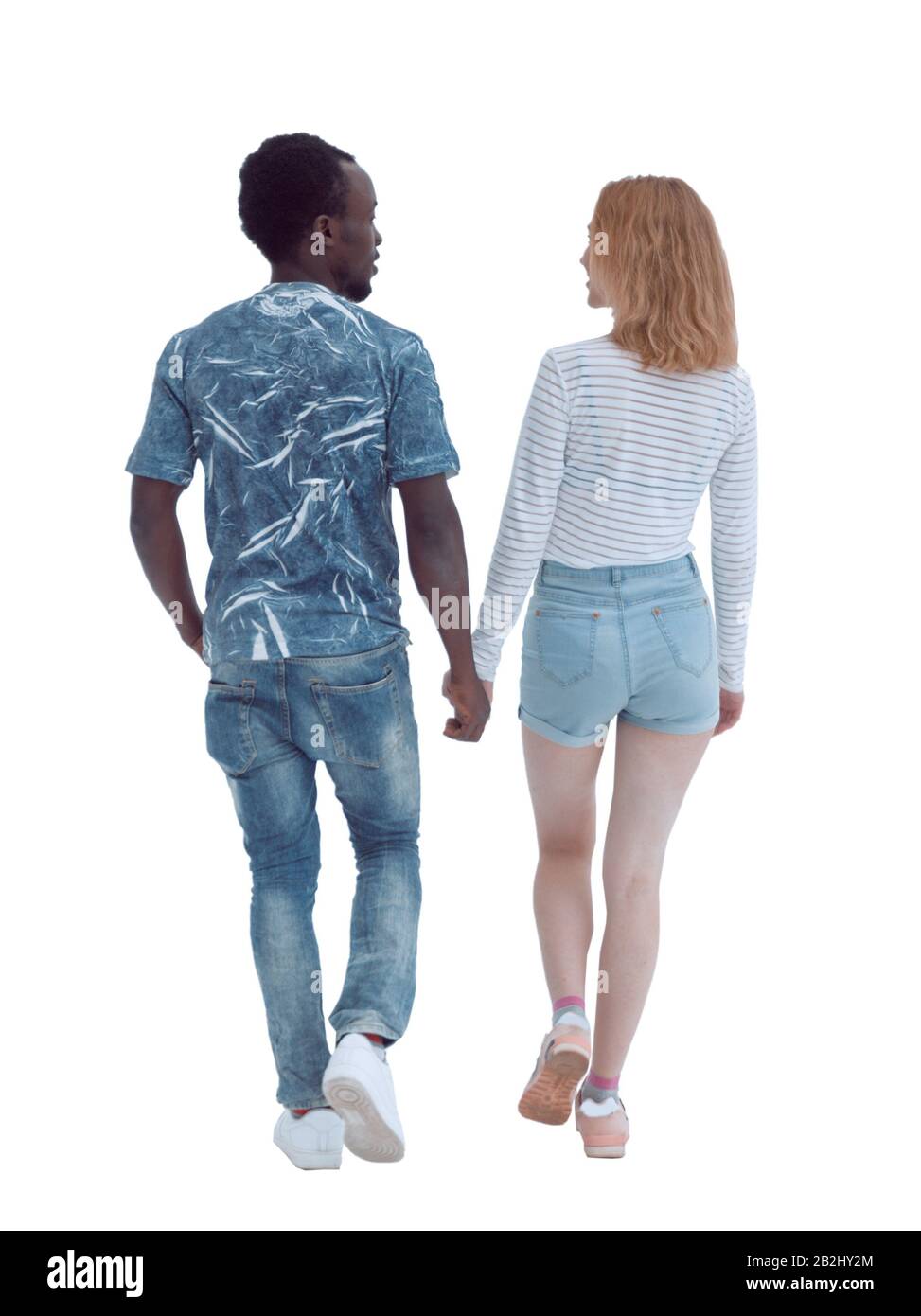 rear view. modern young couple stepping forward Stock Photo - Alamy