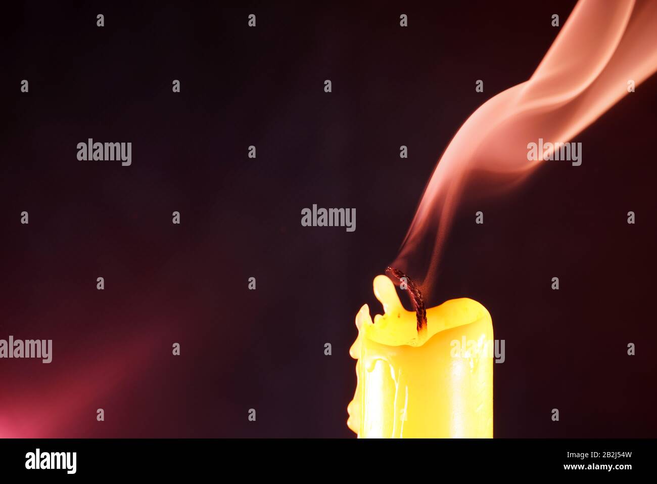 Candle after blowing out the flame photographed with colorful flashes ...