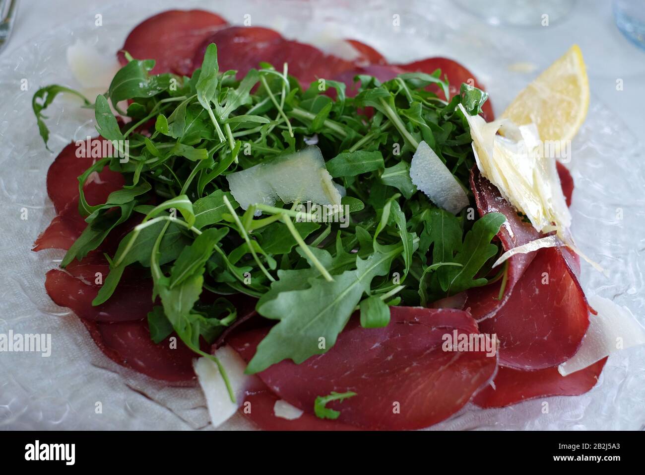 Prosciutto crudo with wilde rocket added at Trattoria alla Maddalena ...