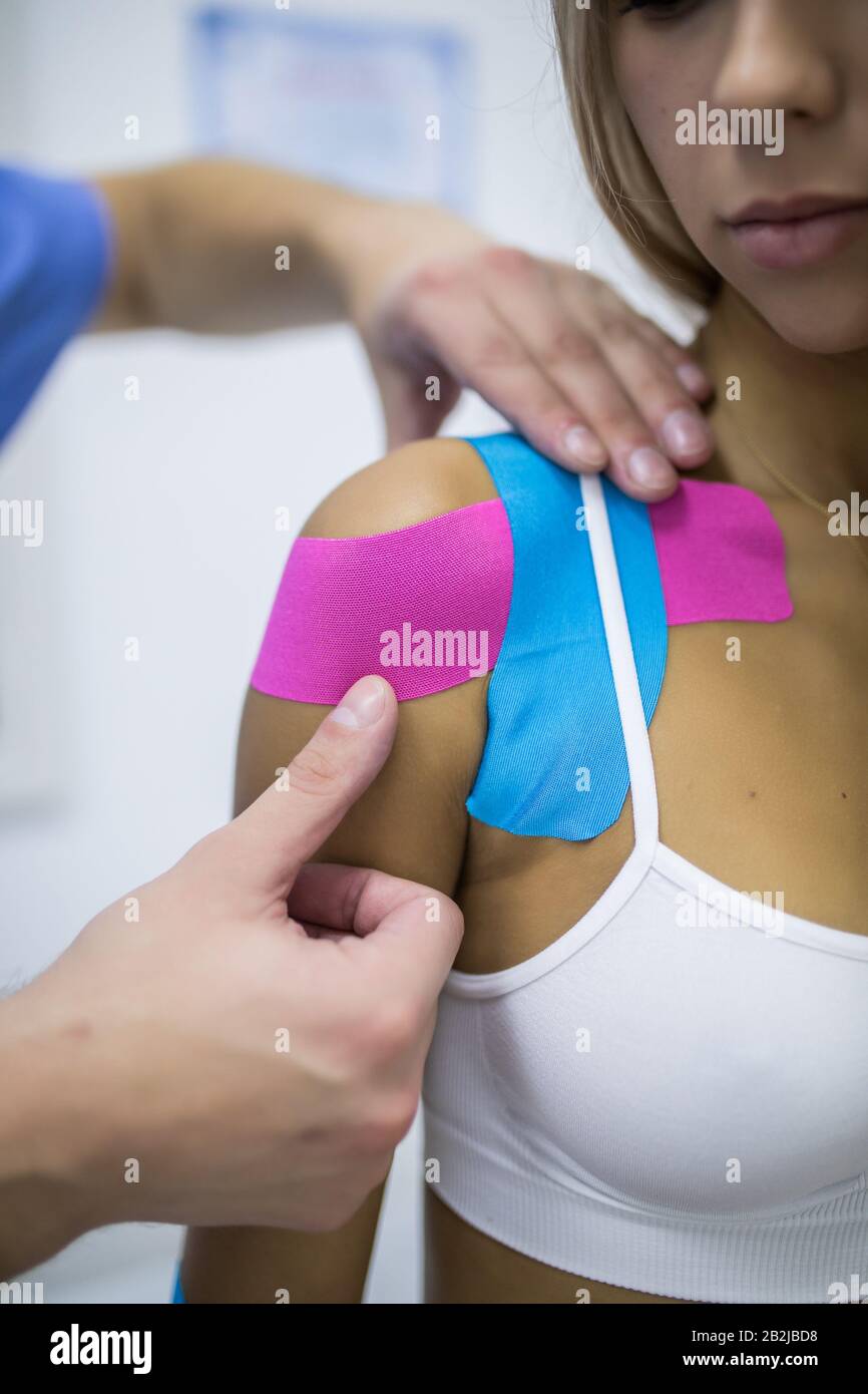 Woman taping neck hi-res stock photography and images - Alamy
