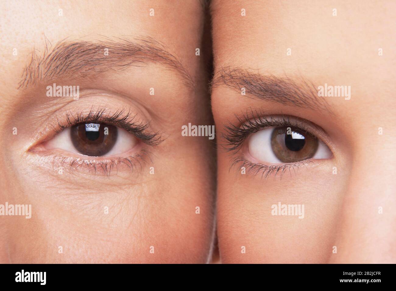 Two women's eyes side by side Stock Photo - Alamy