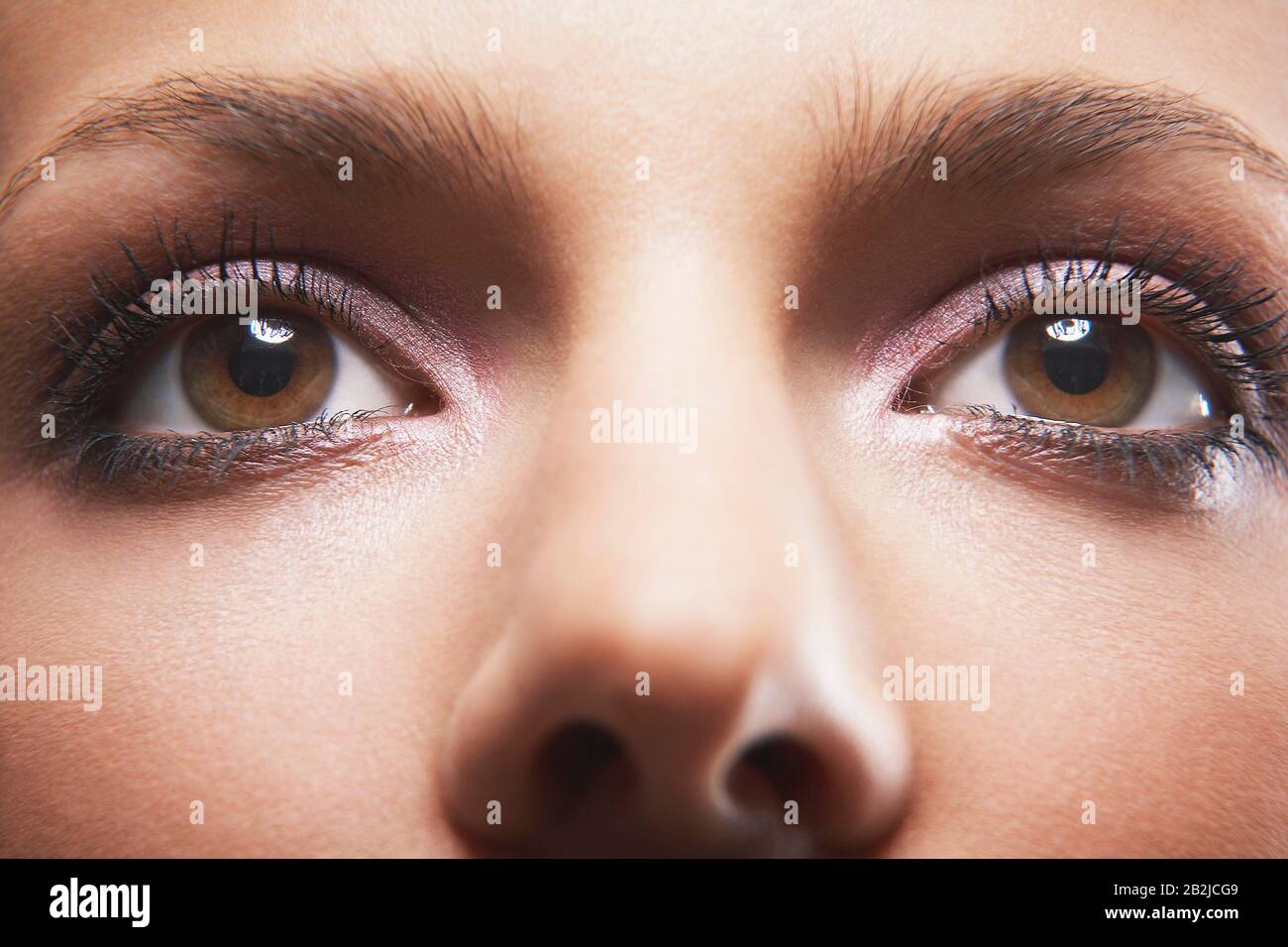 Young woman's eyes with eye shadow looking up Stock Photo - Alamy