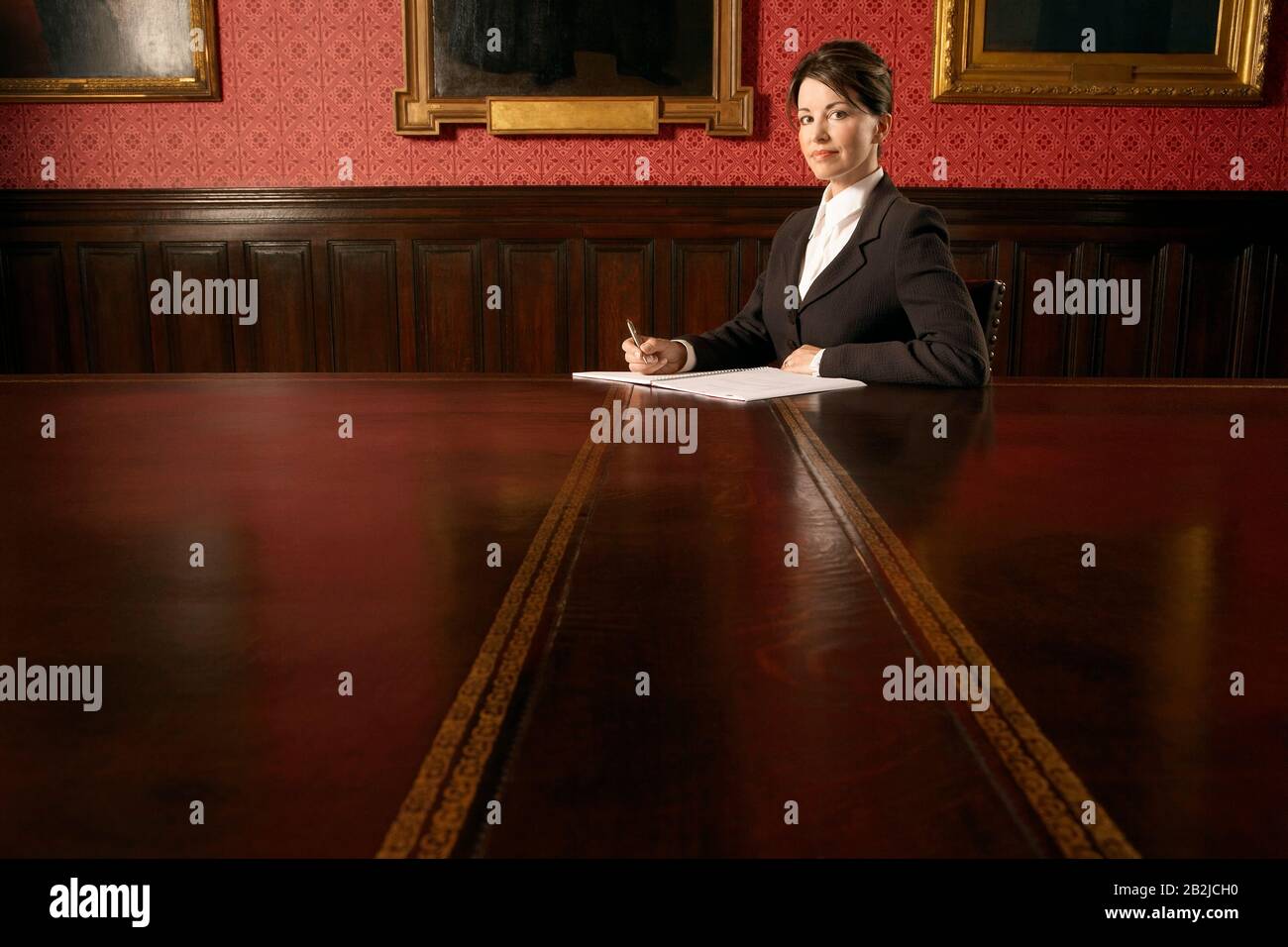 Woman in Conference Room sitting Stock Photo - Alamy
