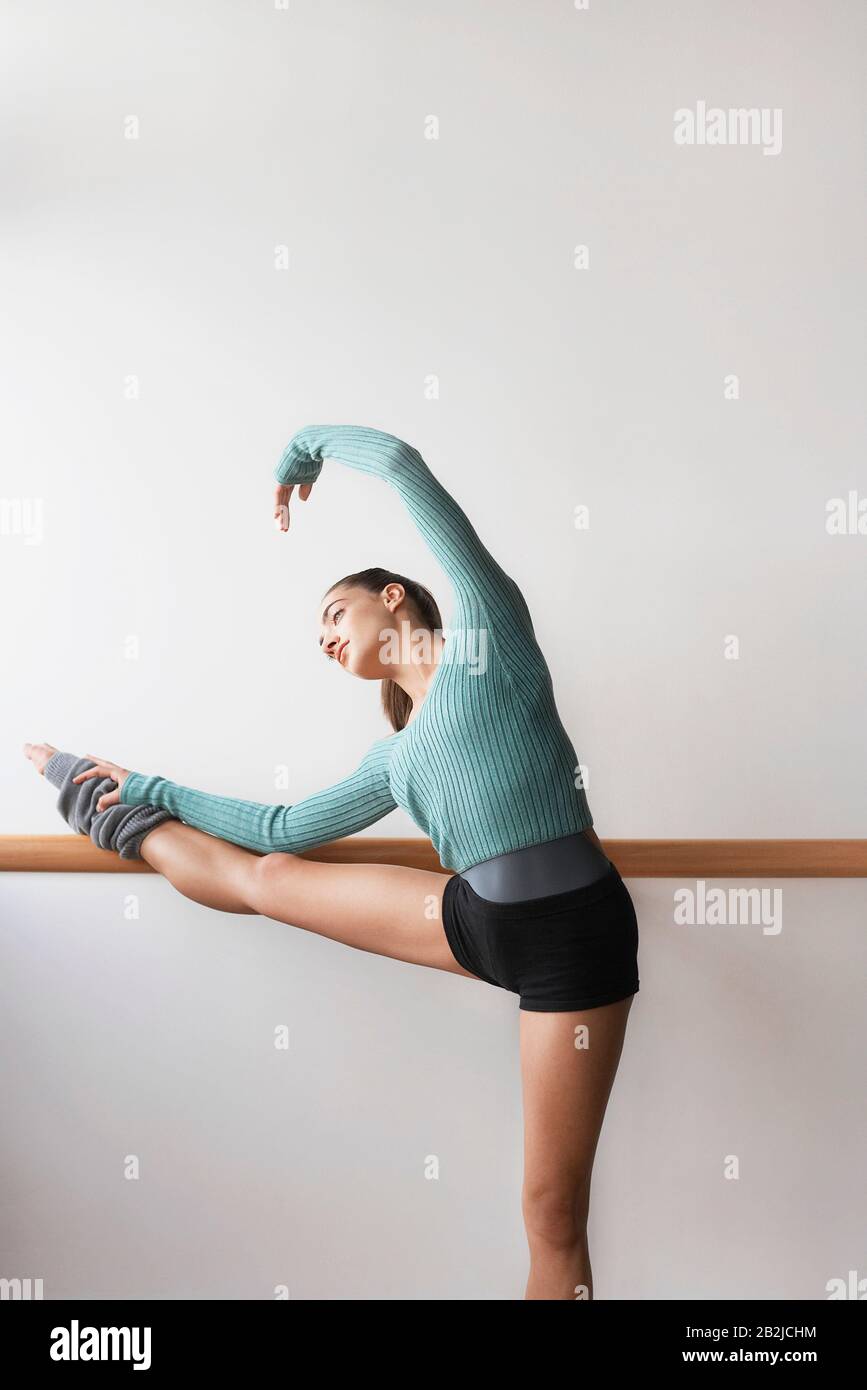 Ballet Dancer bending at bar Stock Photo - Alamy