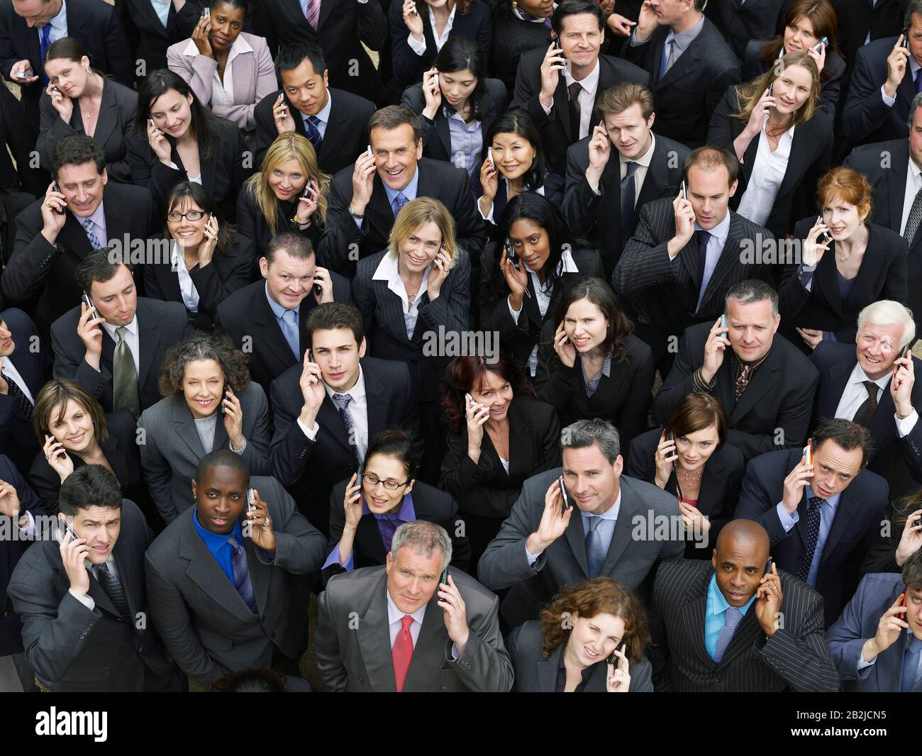 Crowd business people cell phones hi-res stock photography and images ...
