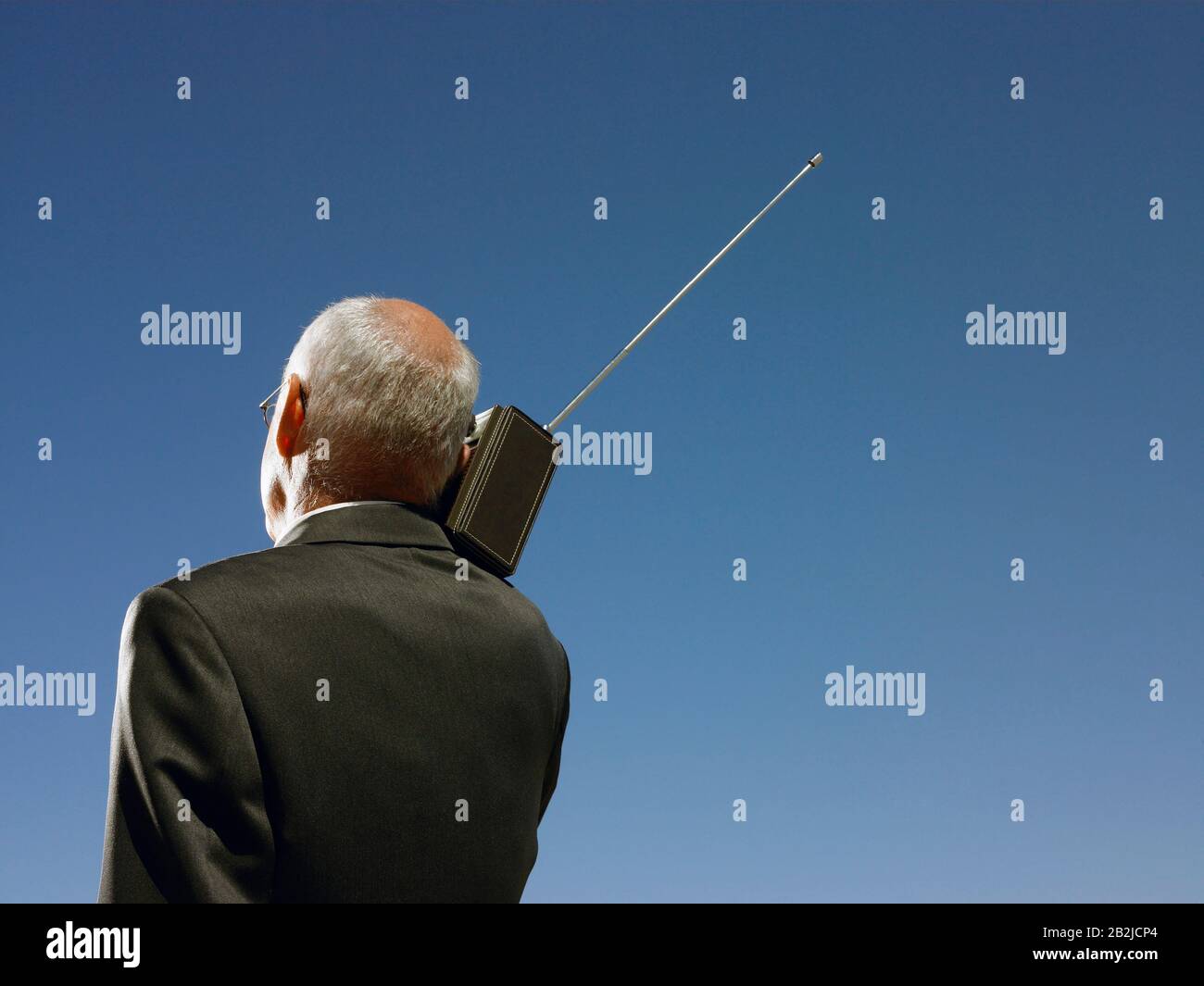 Businessman with radio on shoulder head and shoulders back view Stock ...