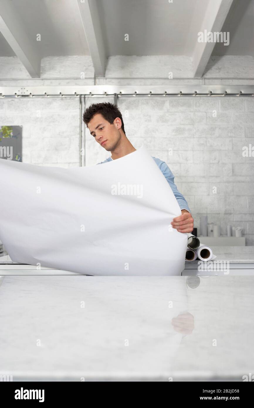 Man Looking at Building Plan Stock Photo - Alamy