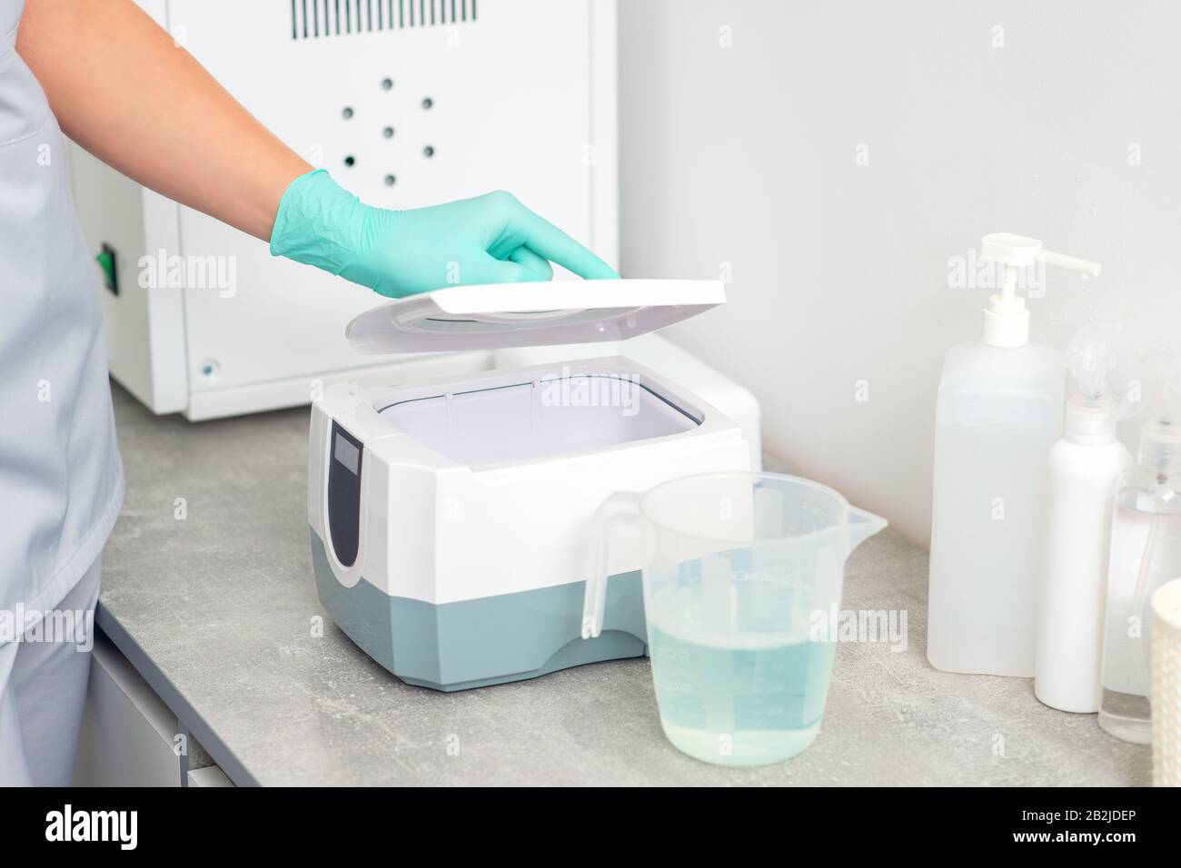 Doctor disinfects the tool. Cleaning systems for medical instruments ...