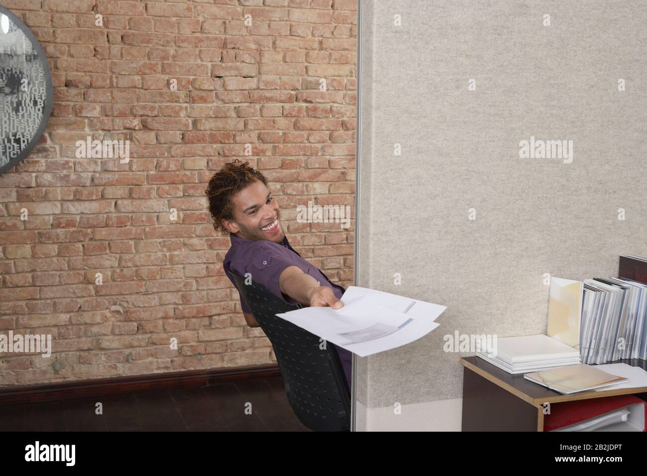Handing papers hi-res stock photography and images - Alamy