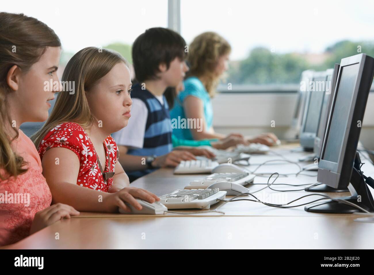 Children (10-12) using computer in computer lab Stock Photo - Alamy