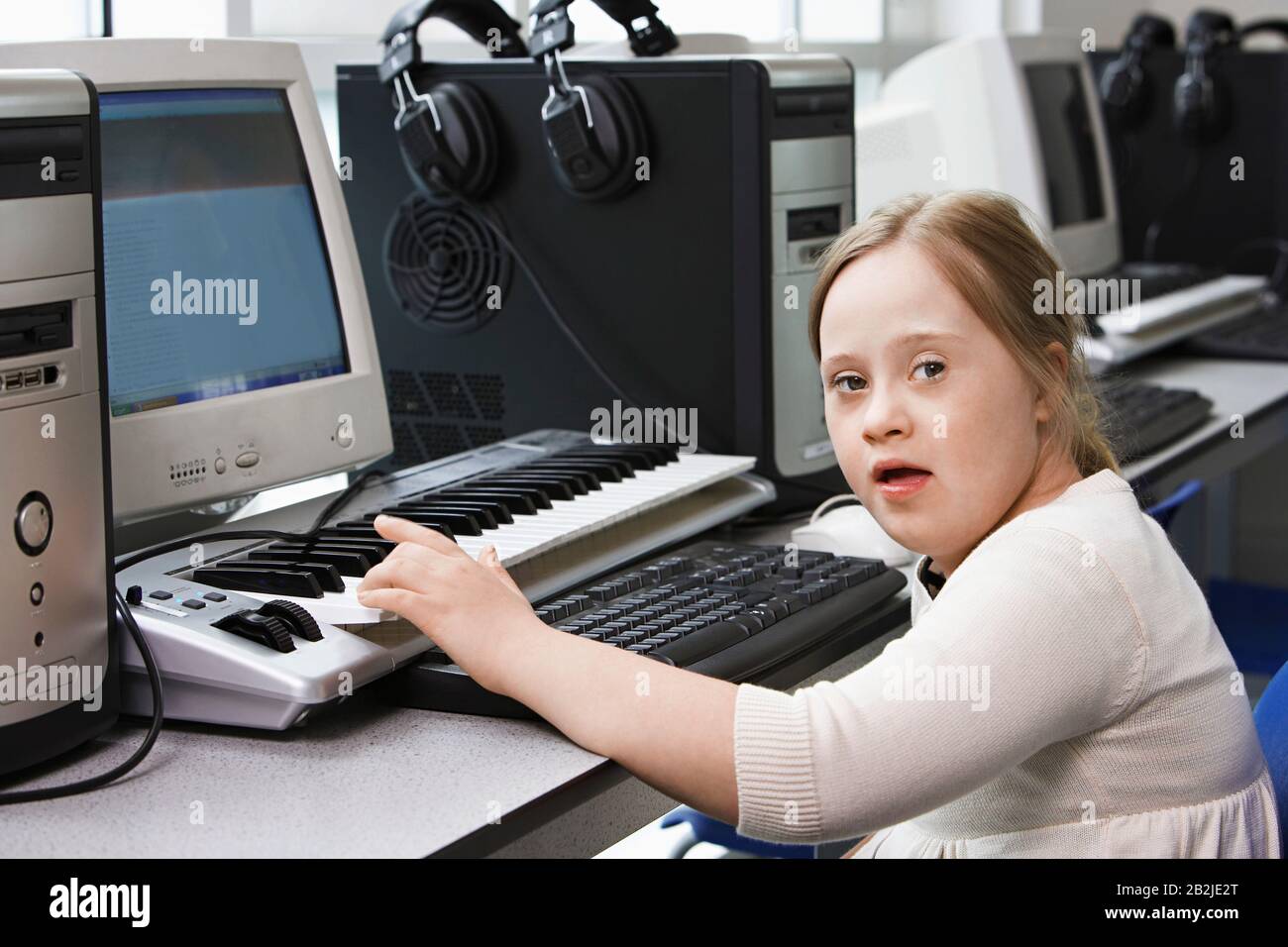 Down syndrome girl computer hi-res stock photography and images - Alamy