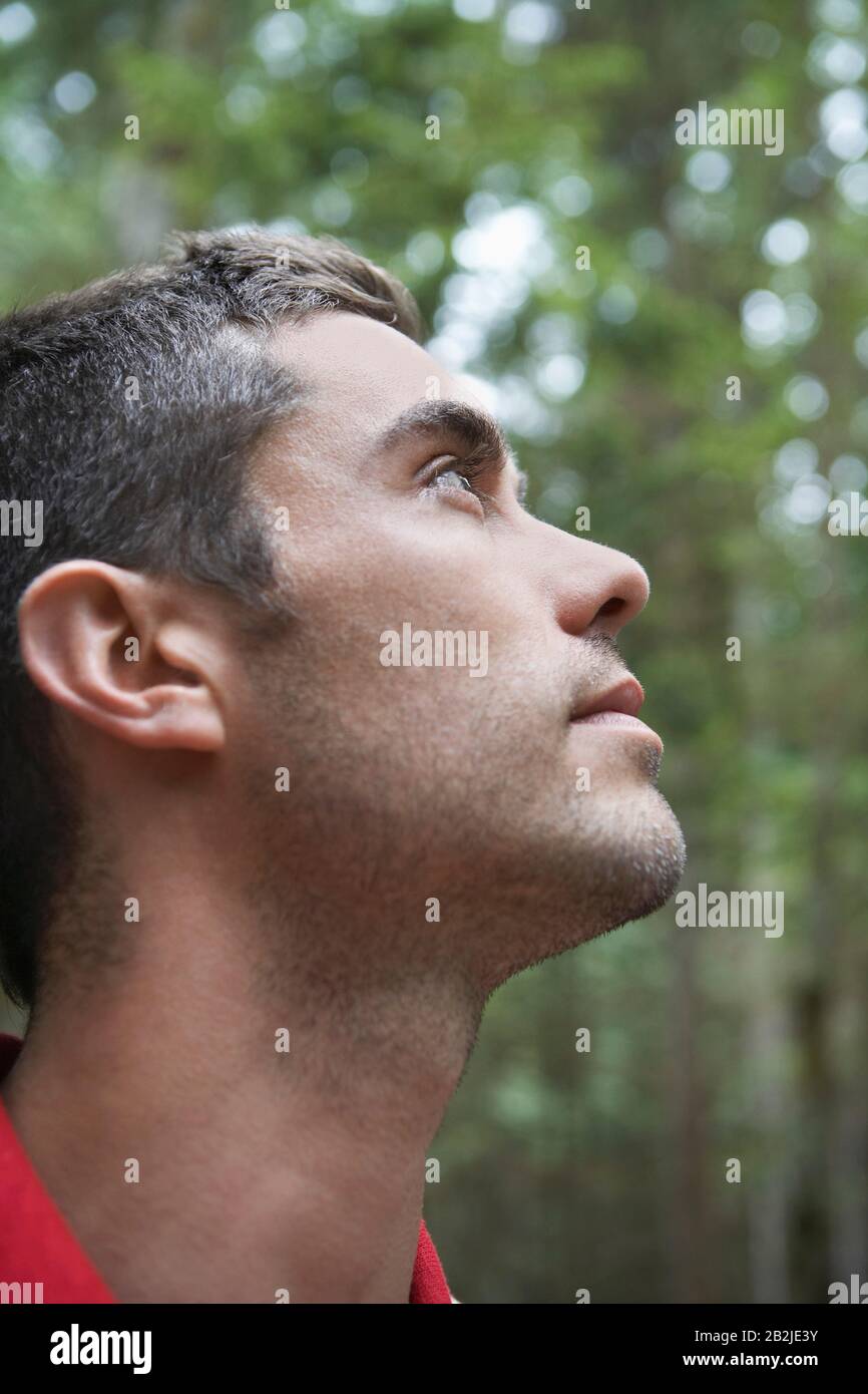 Man looking up outdoors Stock Photo - Alamy