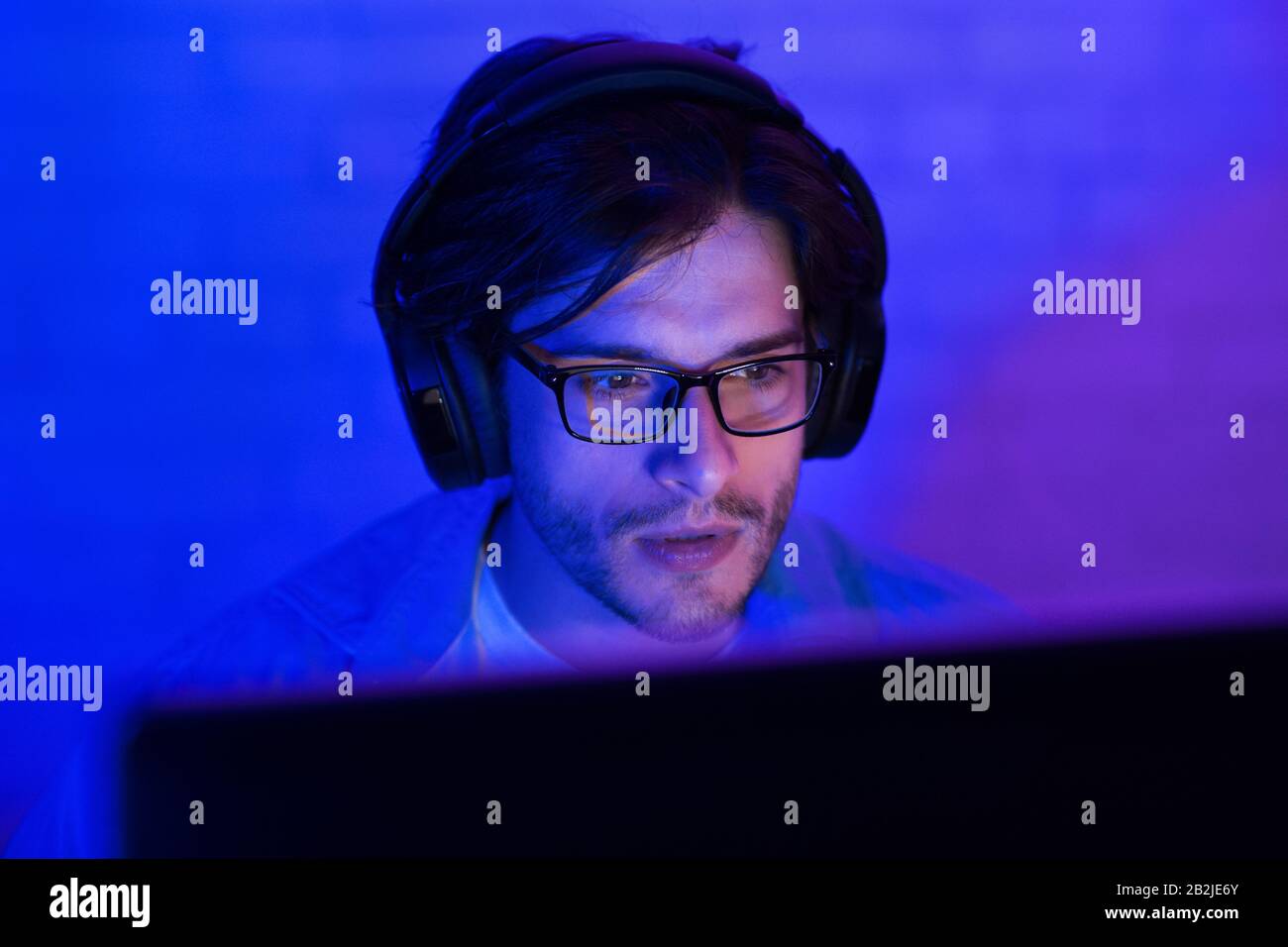 Male developer working on computer hi-res stock photography and images ...