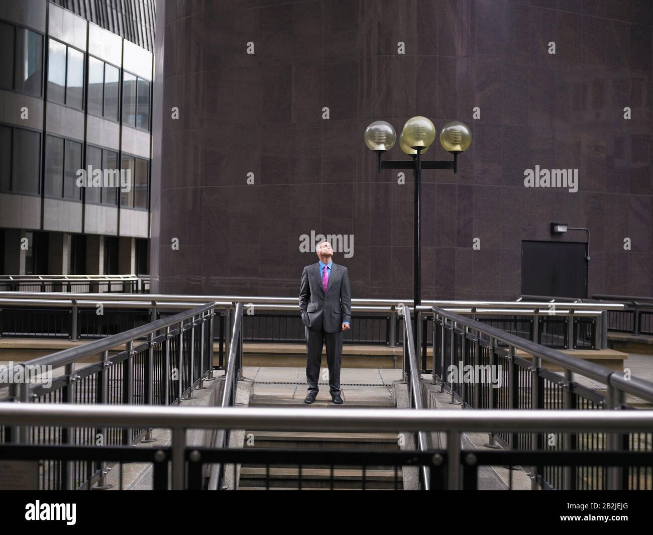 Man at the top of steps hi-res stock photography and images - Alamy
