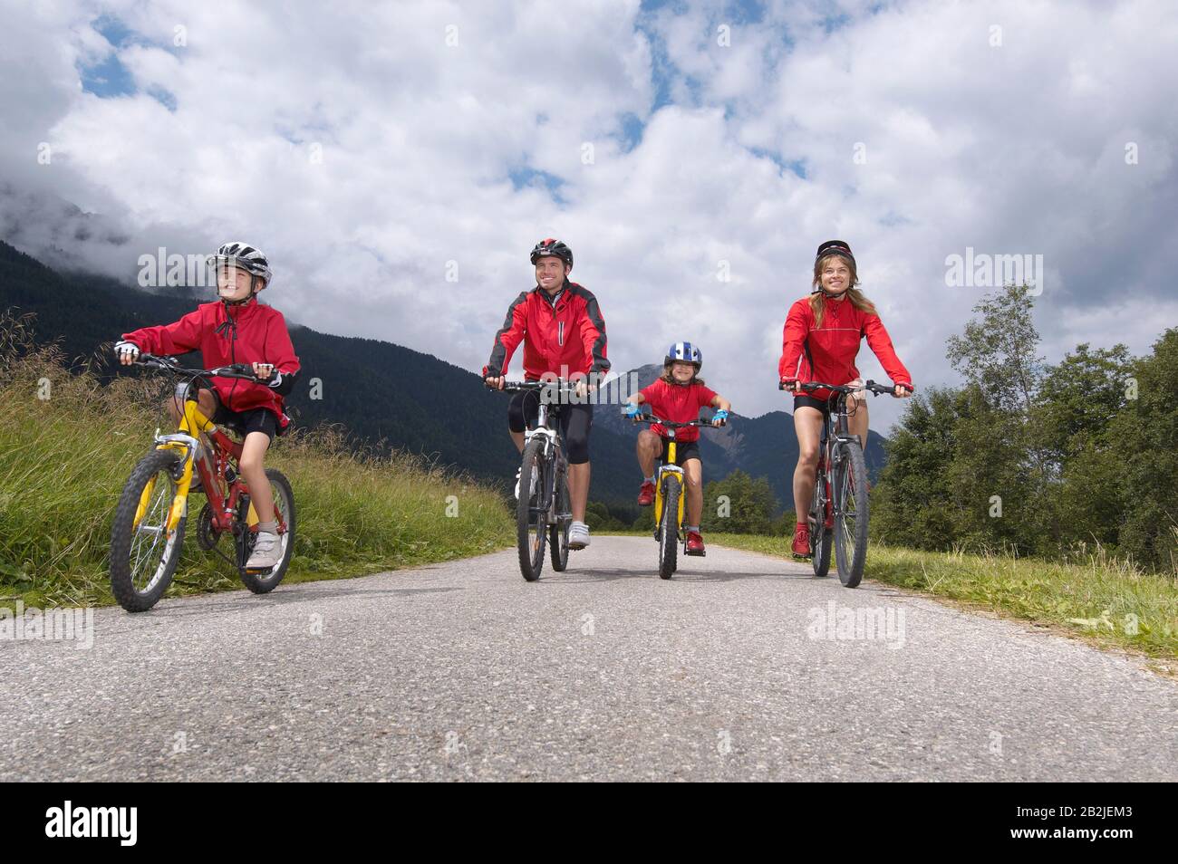 Father and children on the countryside road hi-res stock photography ...