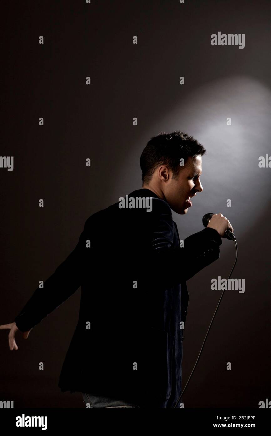 Side profile young man singing hi-res stock photography and images - Alamy