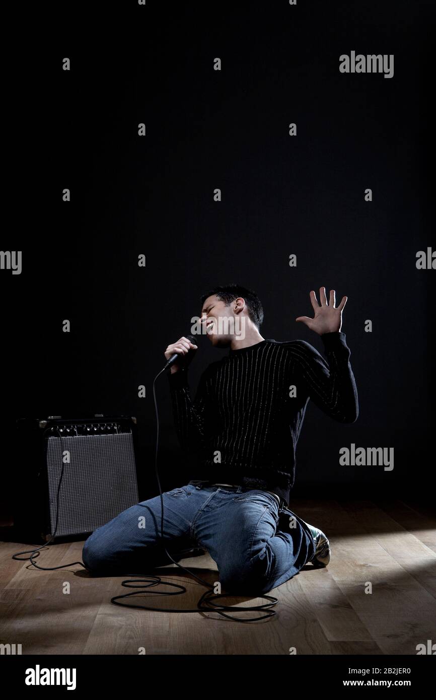 Singing arms raised gesturing hi-res stock photography and images - Alamy