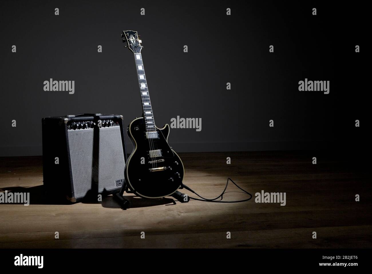 Electric guitar and amplifier on stage Stock Photo - Alamy