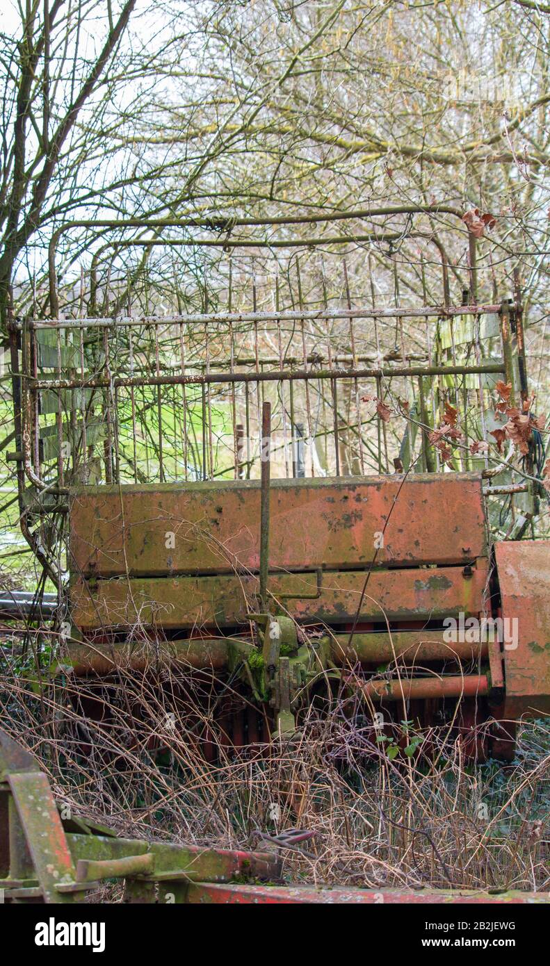 Overgrown old farm equipment hi-res stock photography and images - Alamy