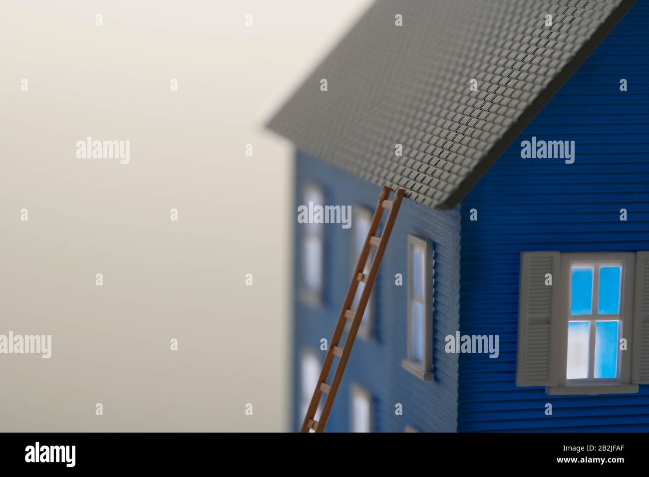 Model of house with ladder close-up Stock Photo - Alamy