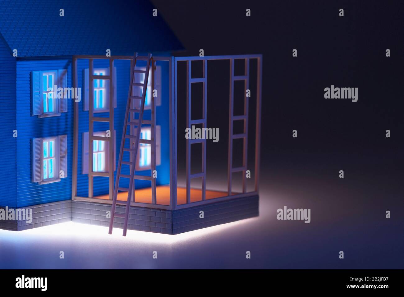 Illuminated model house Stock Photo - Alamy