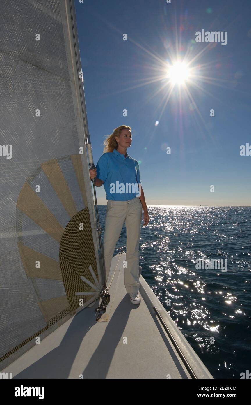 Female sailor on yacht in ocean Stock Photo - Alamy