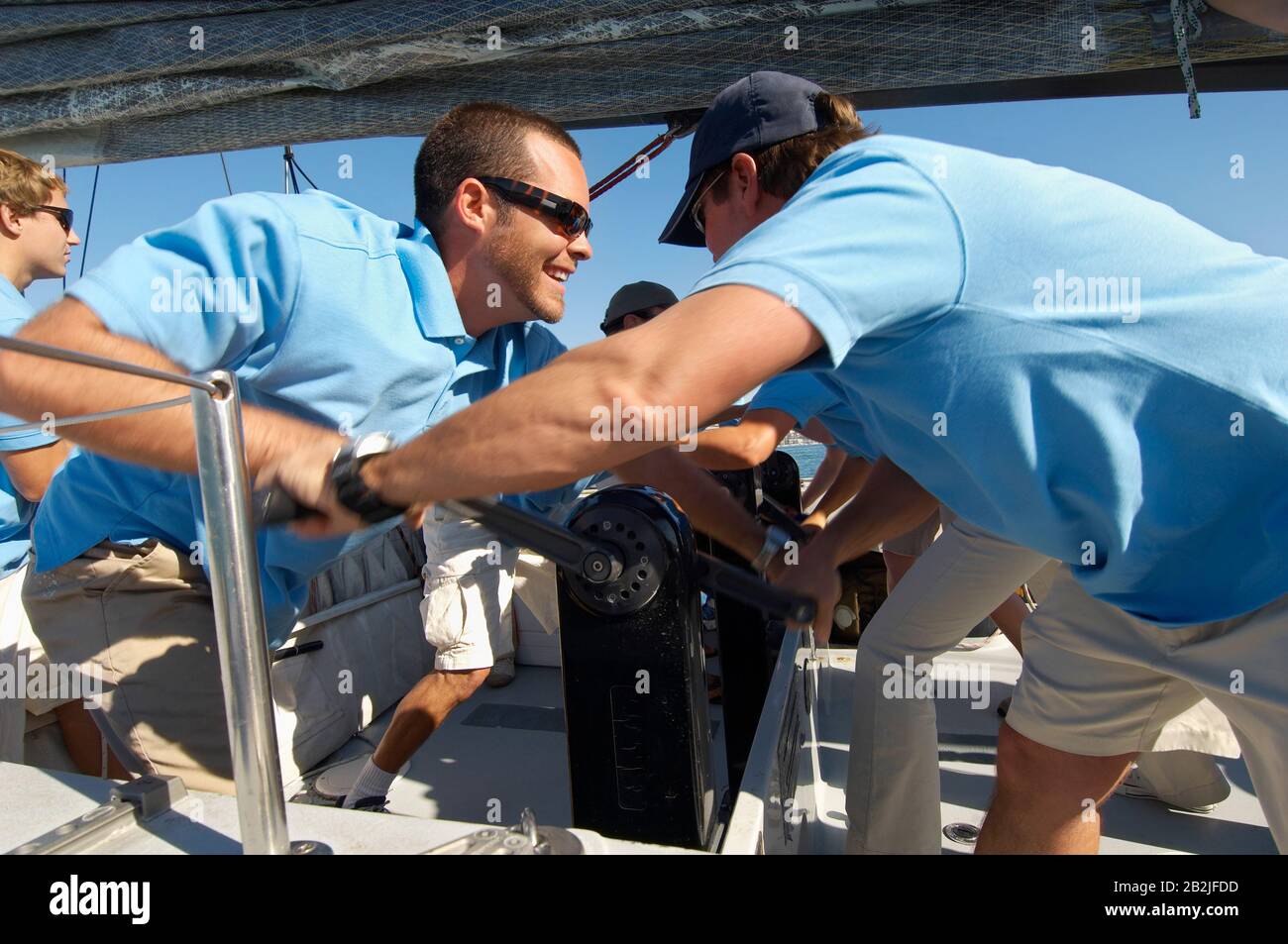 Sailing team on yacht Stock Photo - Alamy