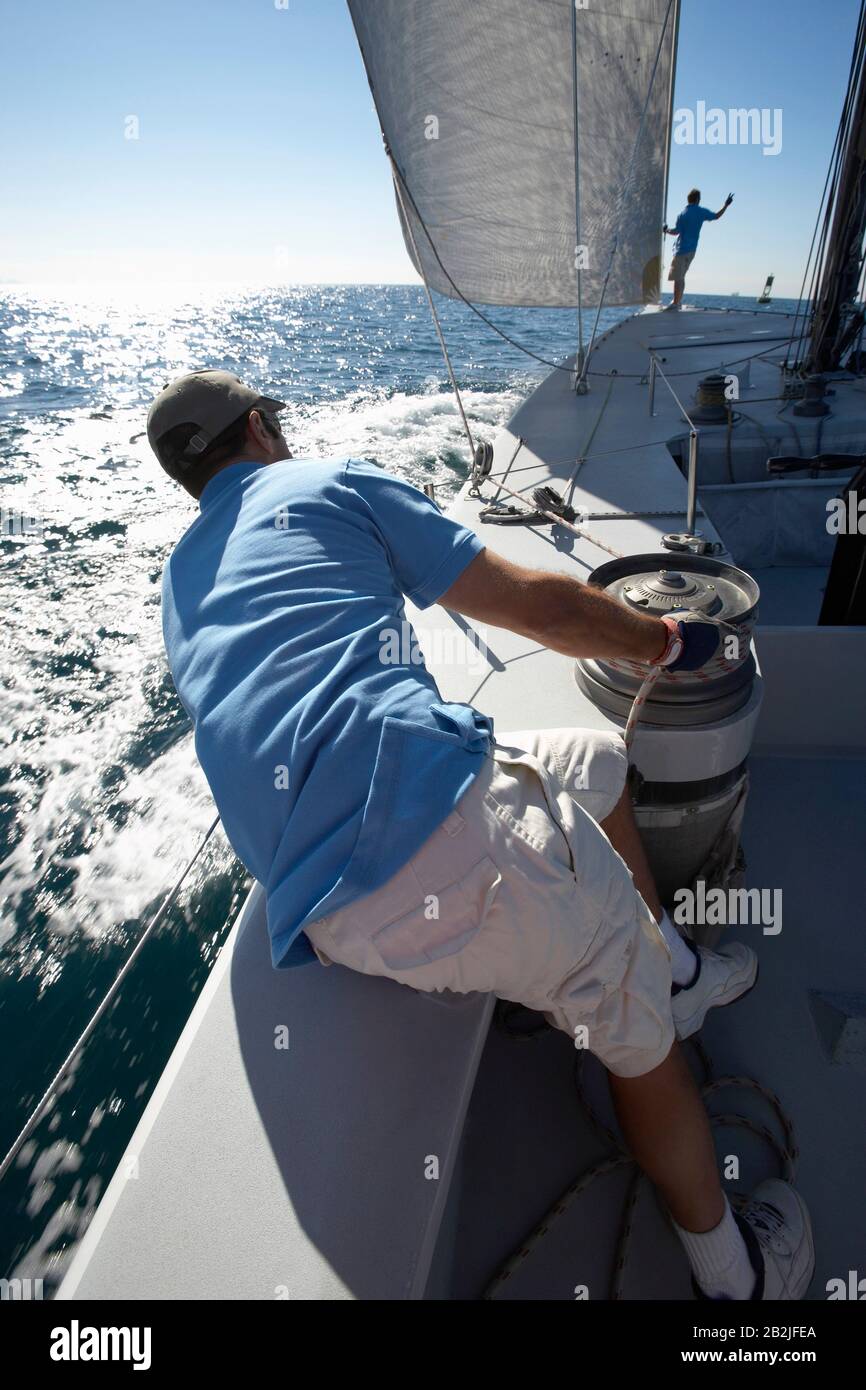 Sailors on yacht in ocean Stock Photo - Alamy