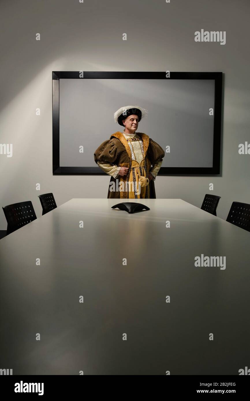 King Henry VIII standing at table in conference room Stock Photo - Alamy