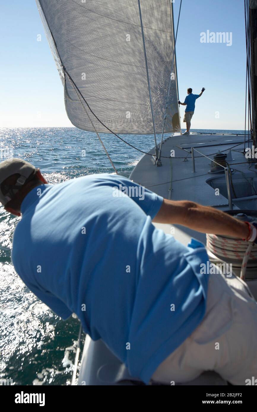 Sailors on yacht in ocean Stock Photo - Alamy